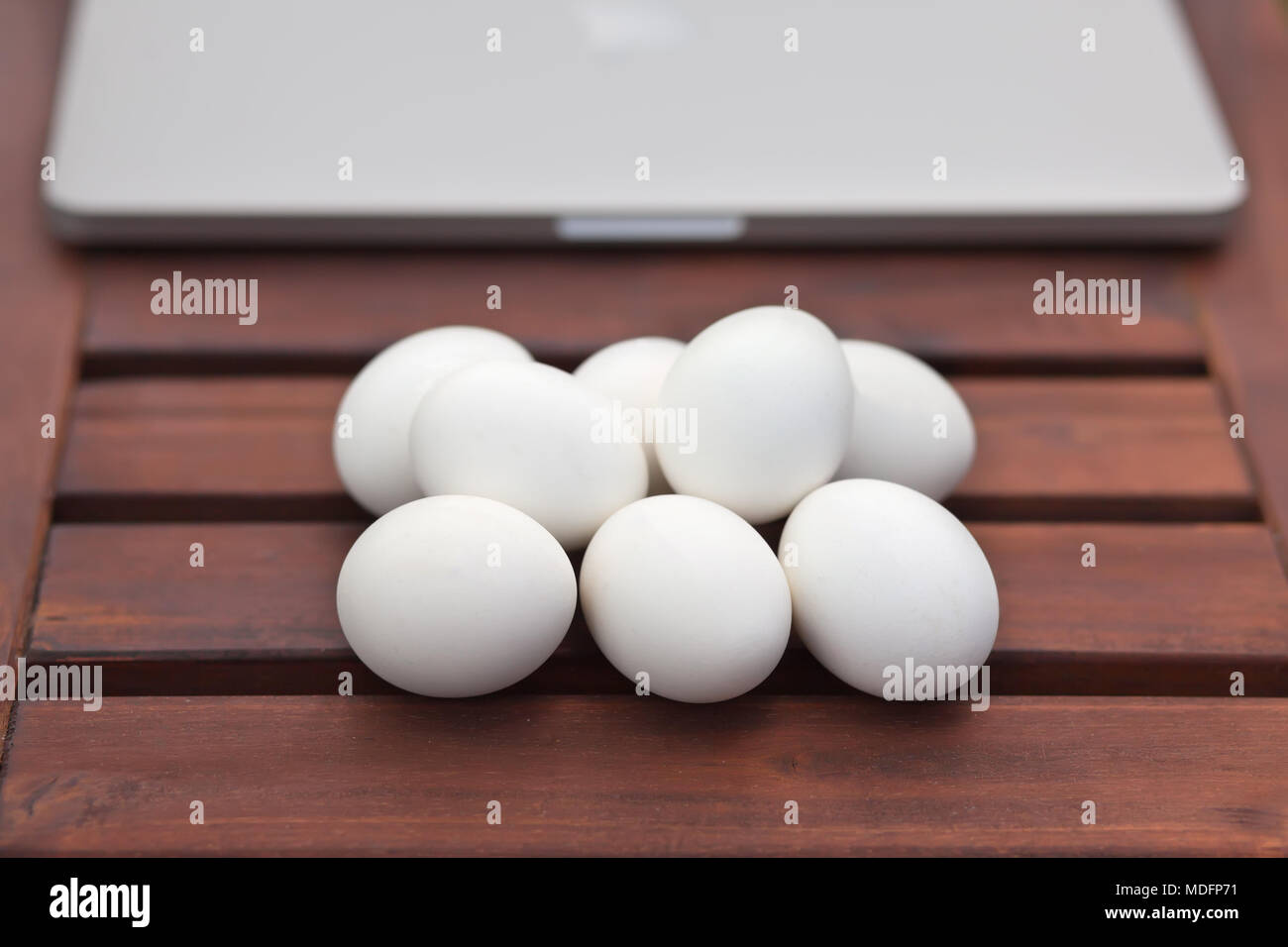 Boiled eggs next to a laptop computer Stock Photo - Alamy