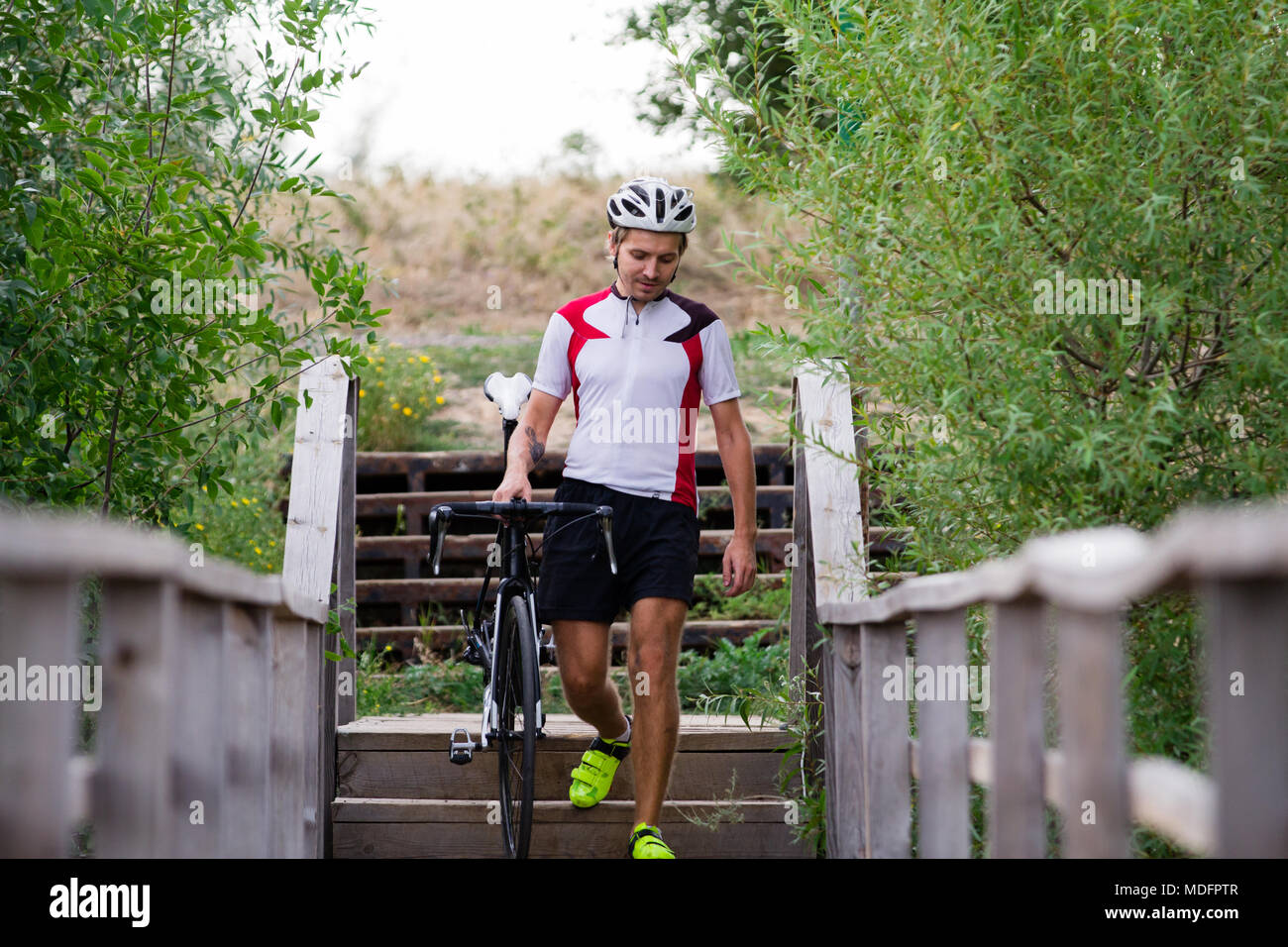 Professional cyclist training offroad riding in fields, bicycle rider ...