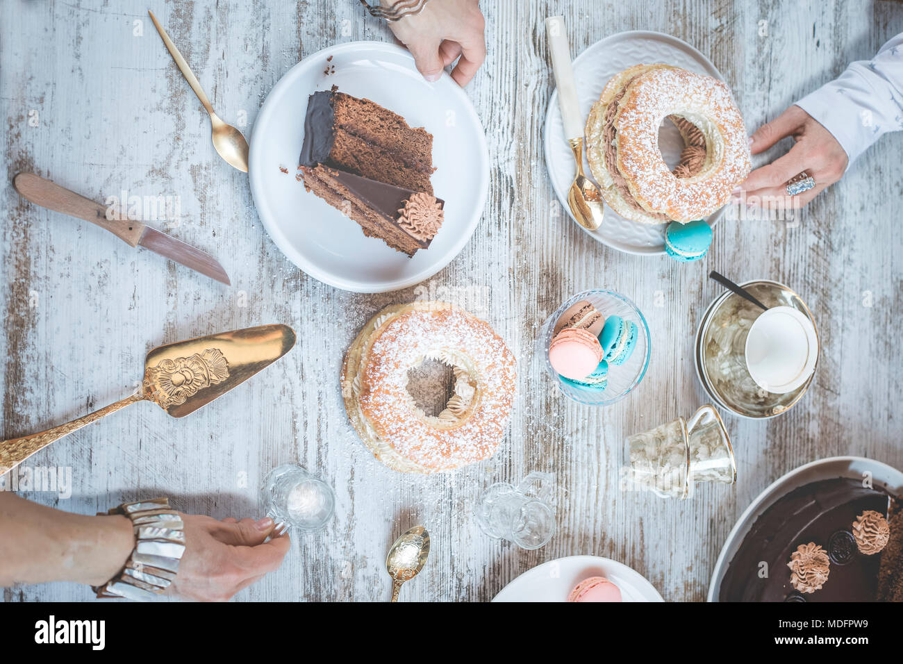 Three women enjoying afternoon tea Stock Photo - Alamy