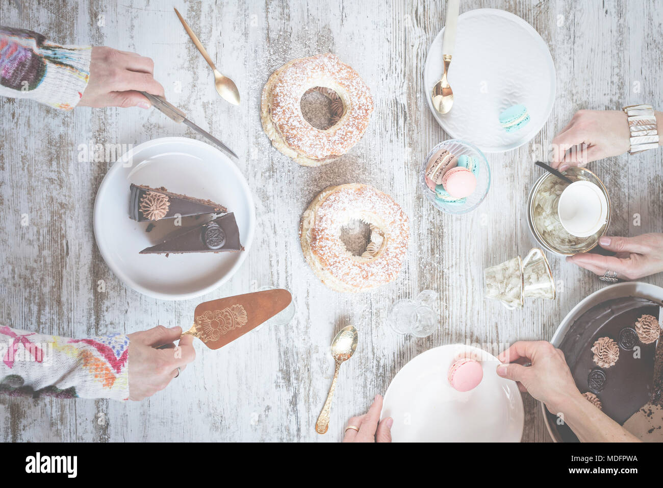 Three women enjoying afternoon tea Stock Photo - Alamy