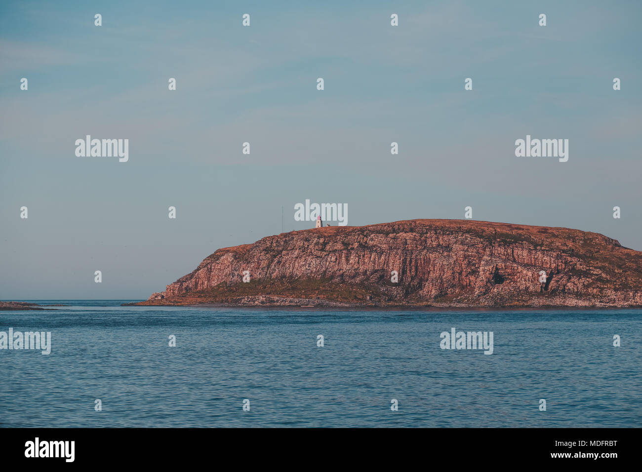 Norway. Small island outside Vardo with a lighthouse to guide ships ...