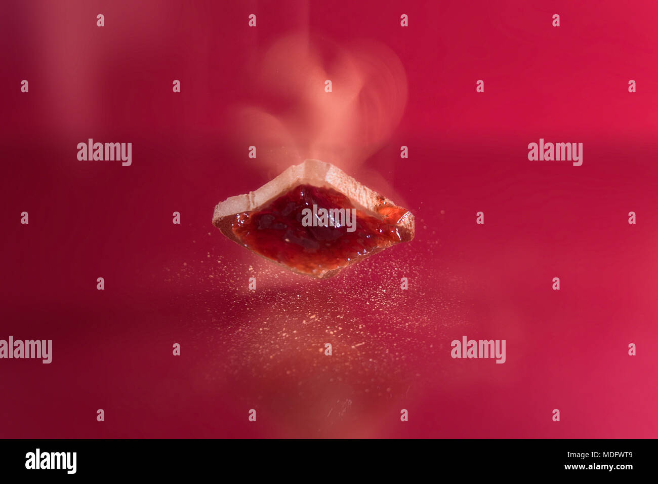 Toast with jam falling on ground Stock Photo - Alamy