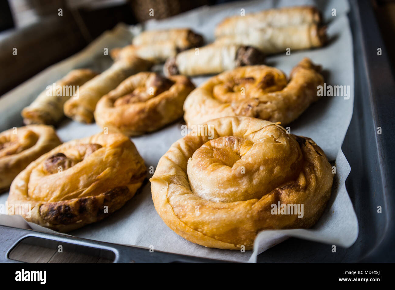 strifti pita borek with cheese, spinach or leek on a tray Stock Photo ...