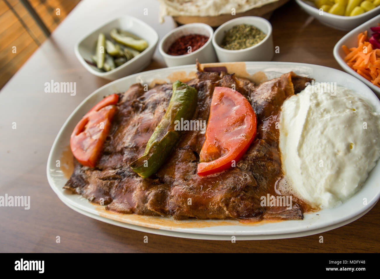 iskender / Turkish Doner with tomato sauce and yogurt Stock Photo - Alamy