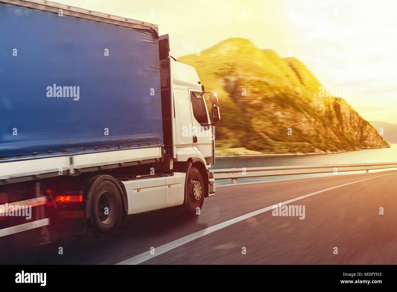 truck-run-fast-on-the-highway-to-deliver-stock-photo-alamy