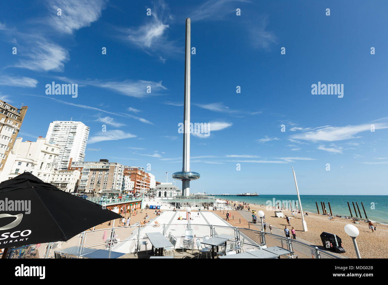 People admire walking on Brighton costline, view of English channel ...