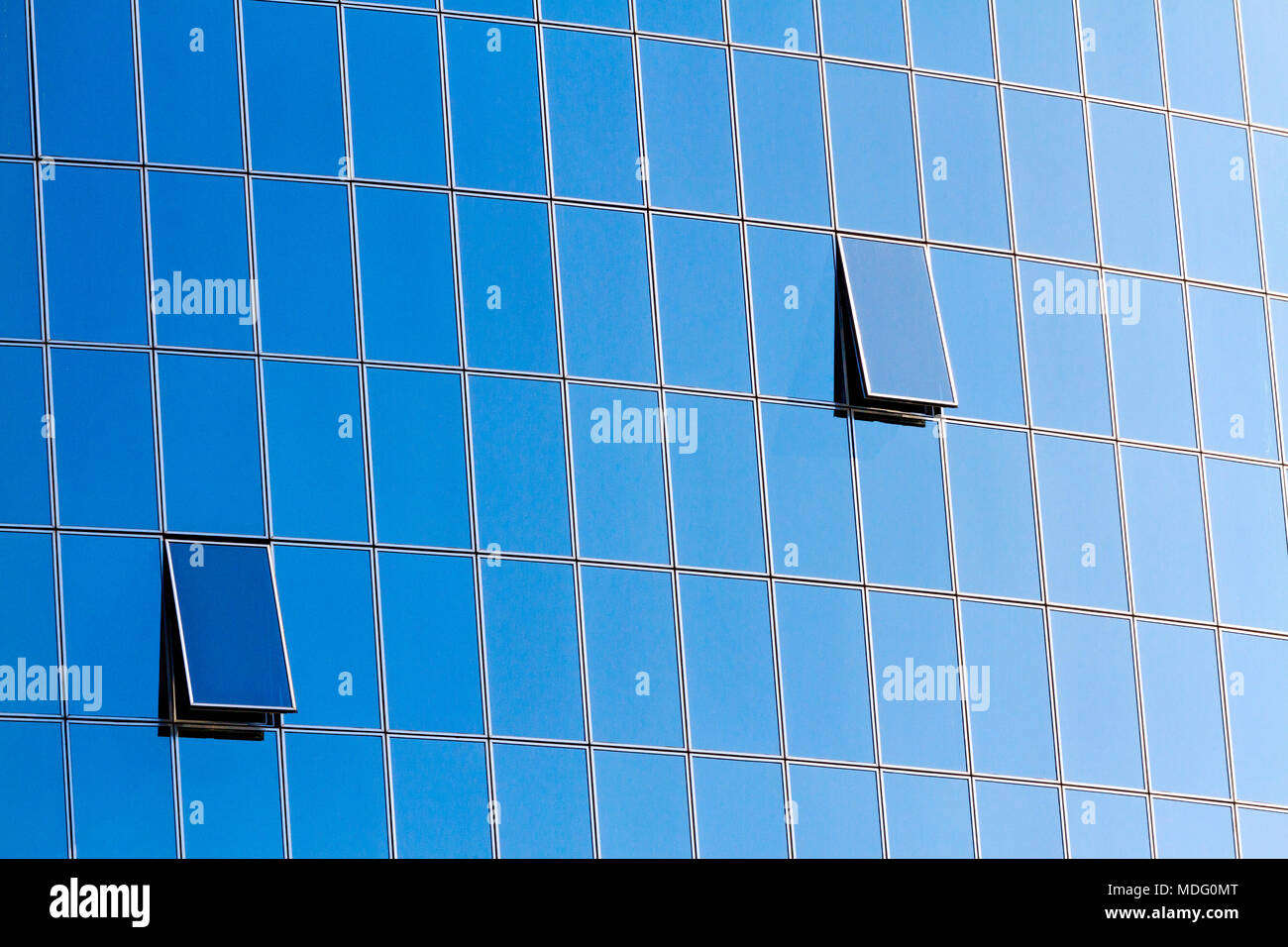 clean office windows that reflect the blue sky, business, new ...