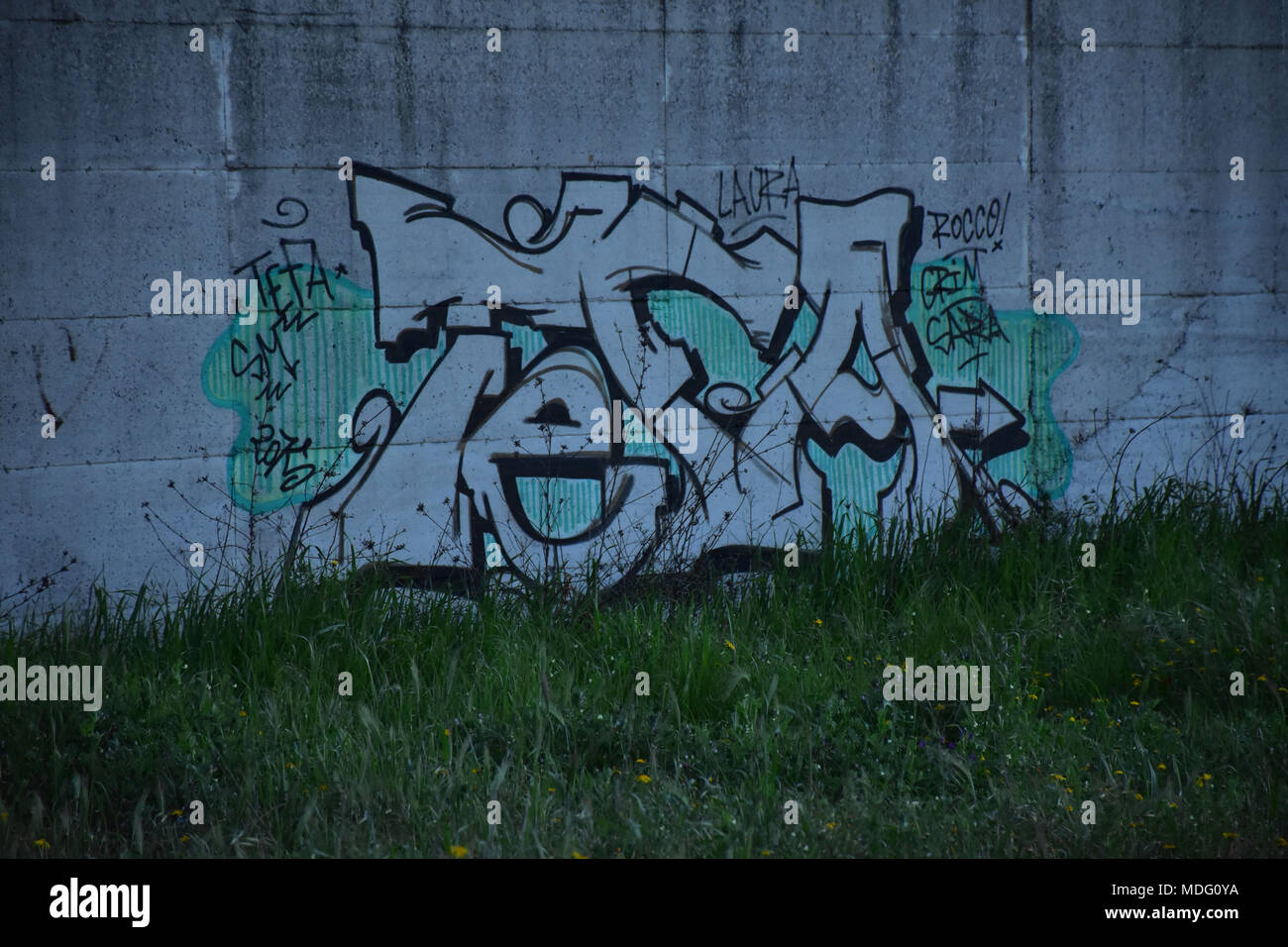 Graffiti on country wall Stock Photo - Alamy