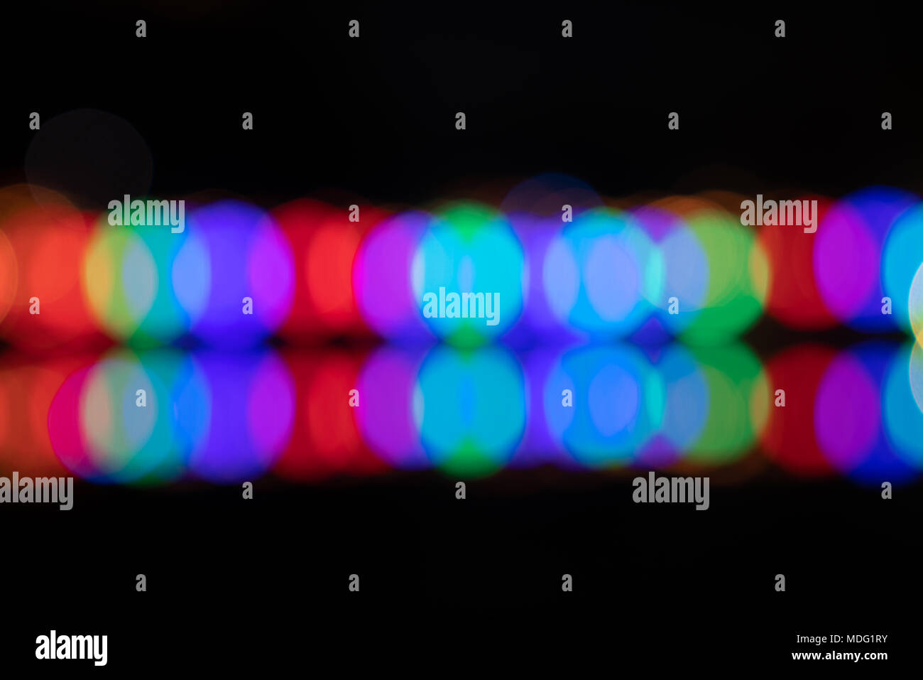 Bokeh colorful circles background of primary colors in two horizontal ...