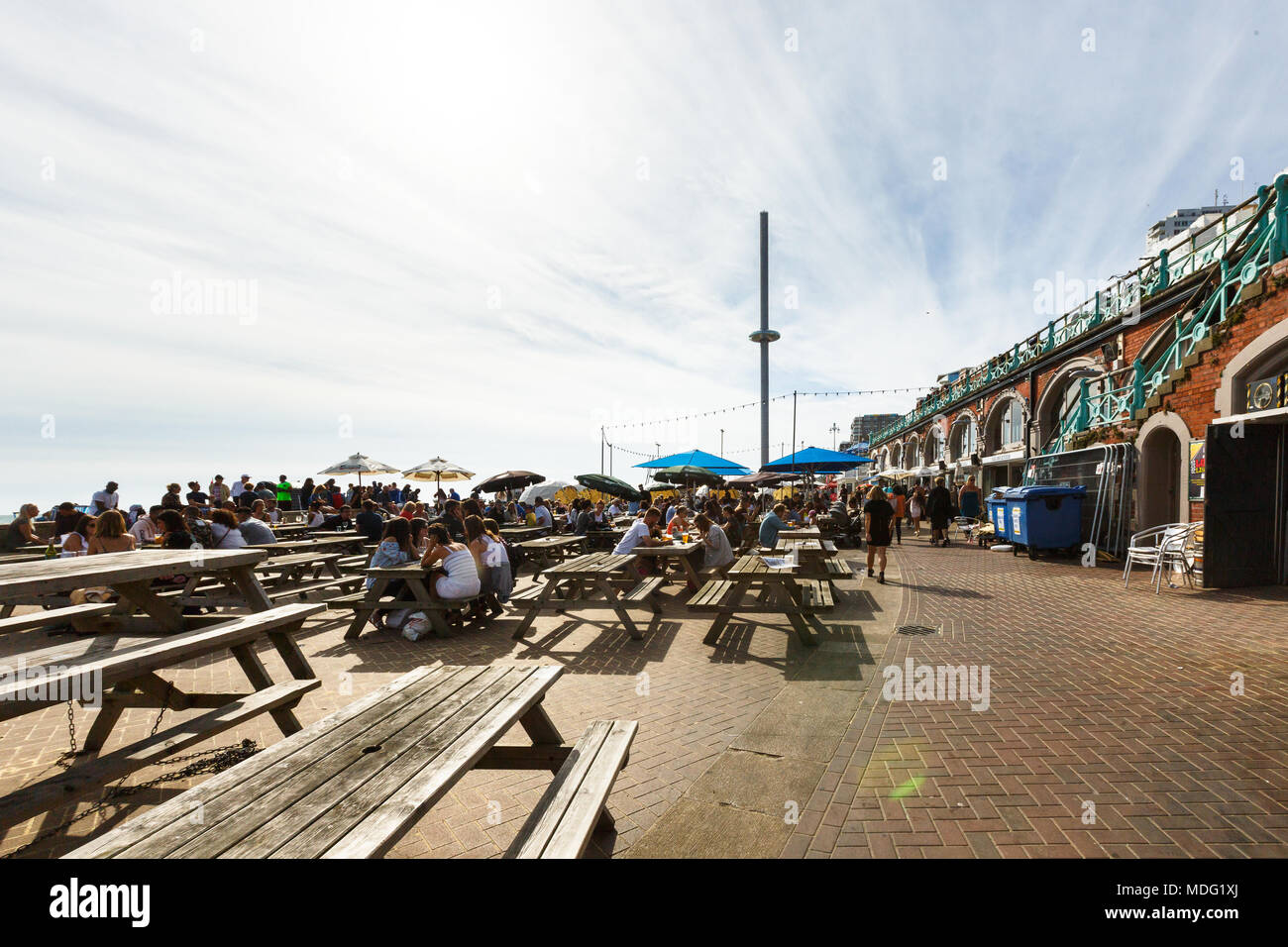 People have rest in Brighton costline restaurants, English channel ...