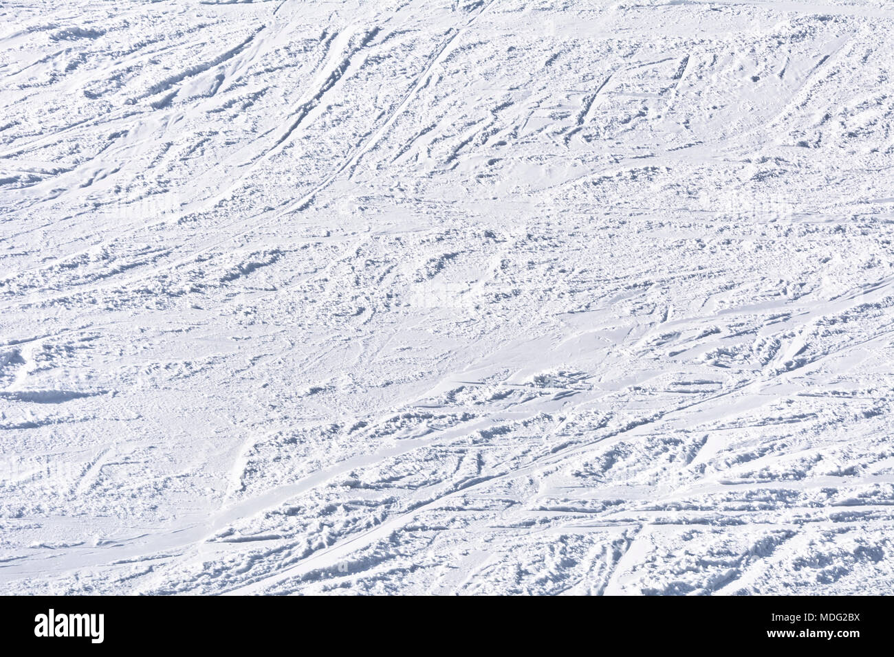Ski slope with traces of skis on a sunny day. Background, texture Stock ...