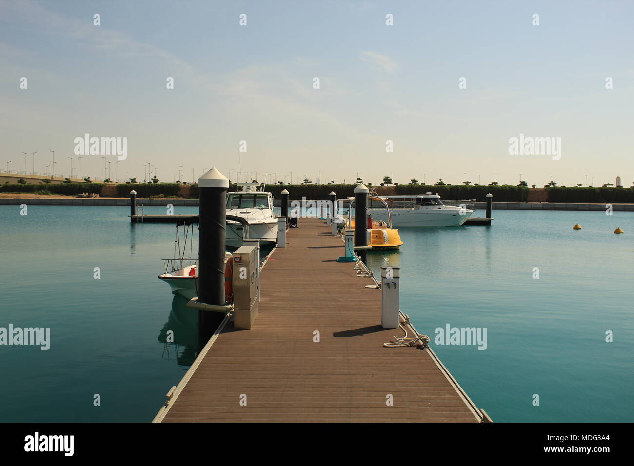 A beautiful and modern view of a tiny harbor, parked with boats and ...