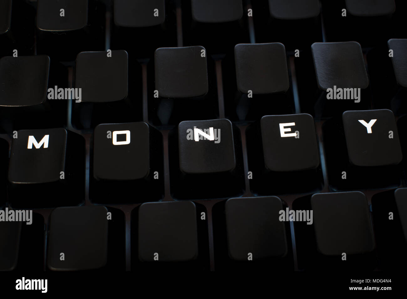 Money word on keyboard with rearranged letters, backlit keys Stock ...