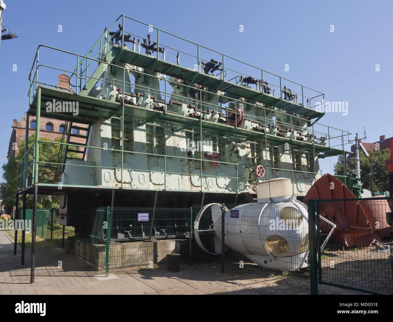 Gigantic ships engine and small under water submarine are parts of the ...