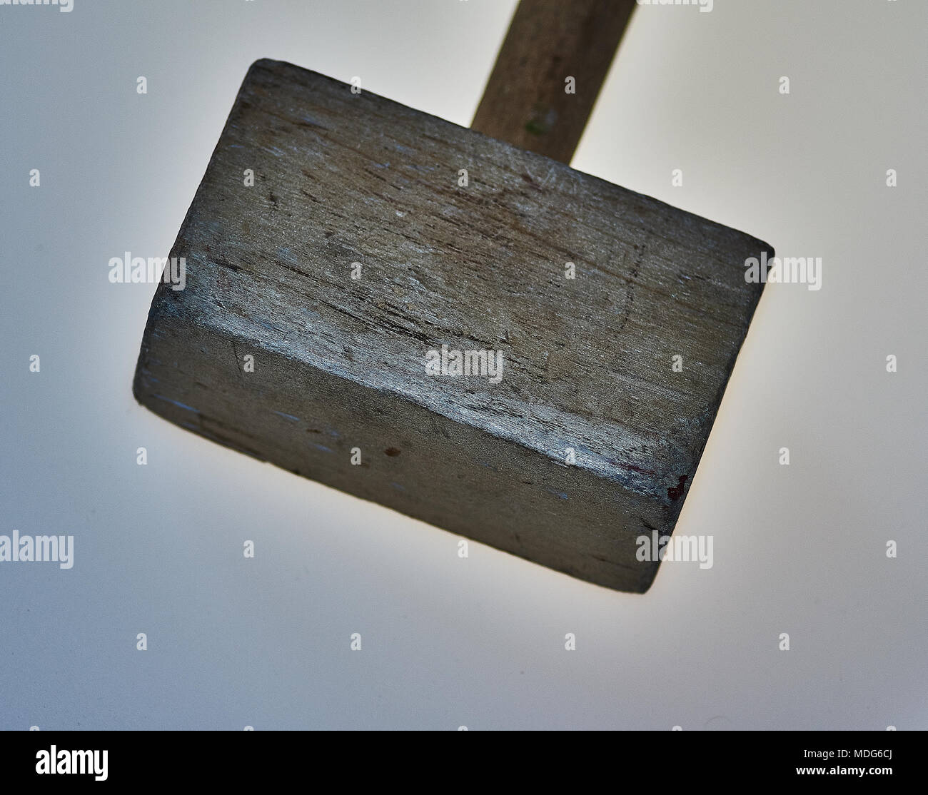 A hammer from a tree lies on an isolated background. The hammer was ...