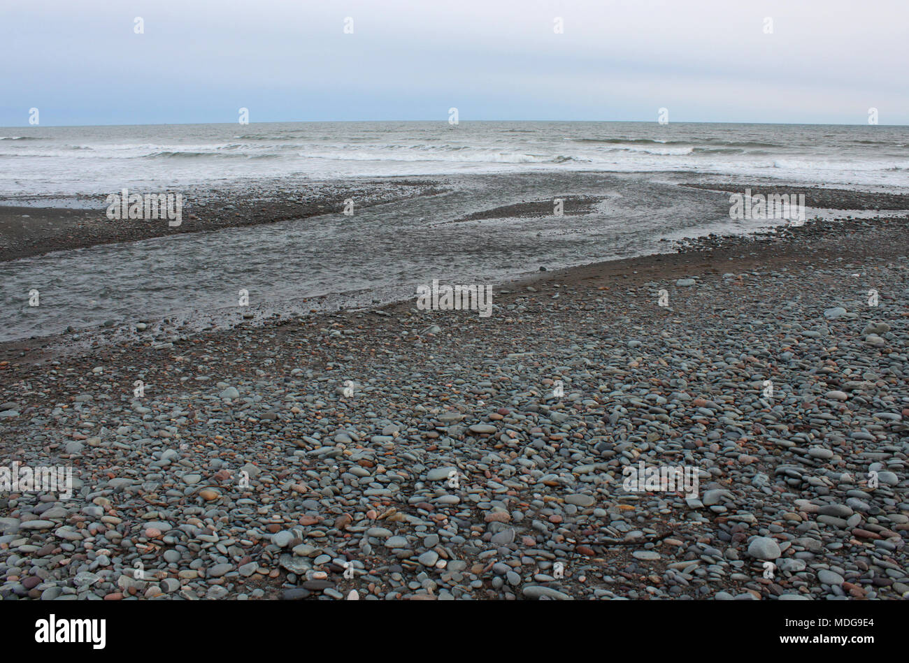 Temporary stream draining Big Lake after barrier breach at Long Beach ...
