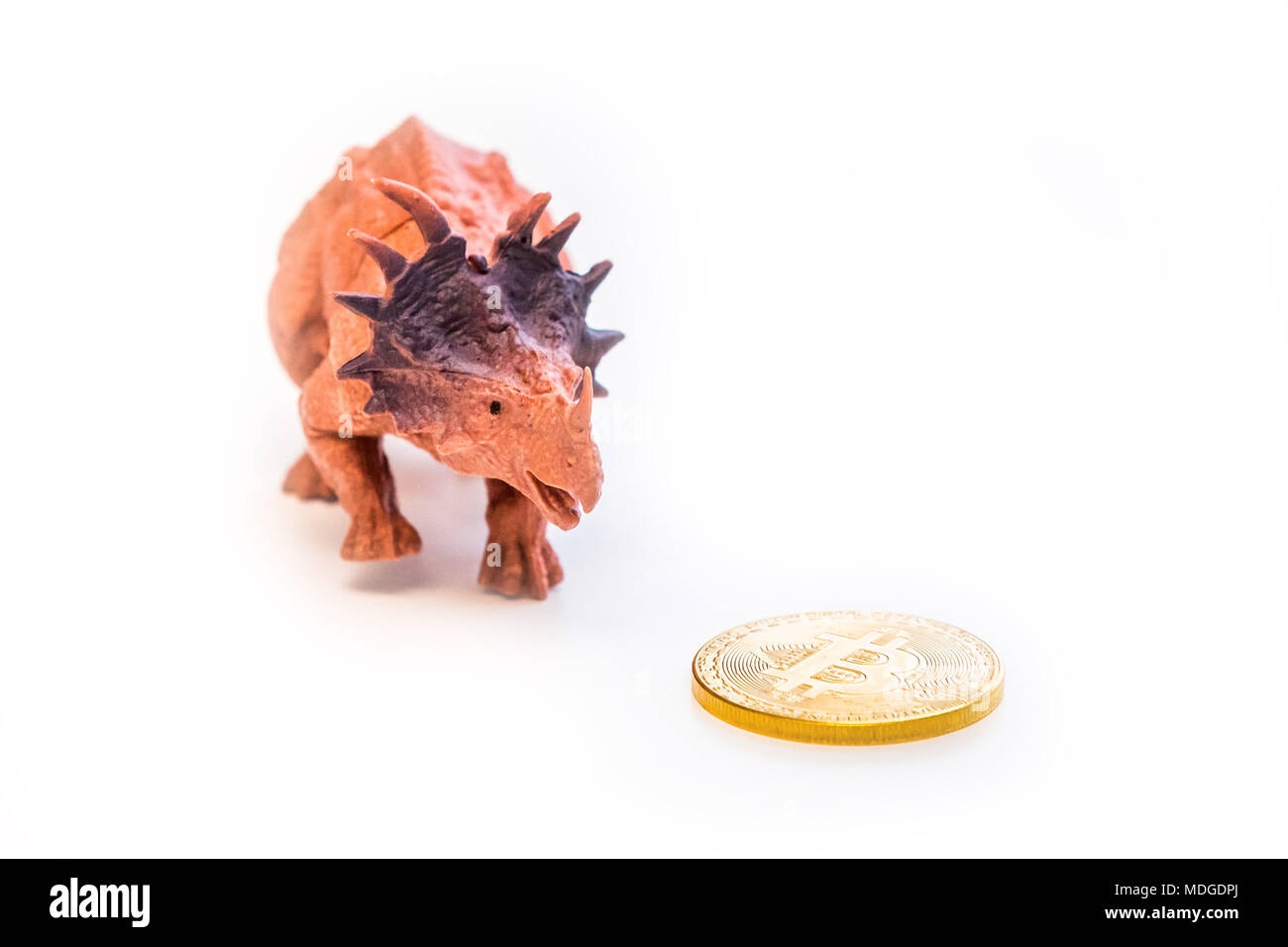 Dinosaurs meet bitcoin concept isolated on white Stock Photo - Alamy
