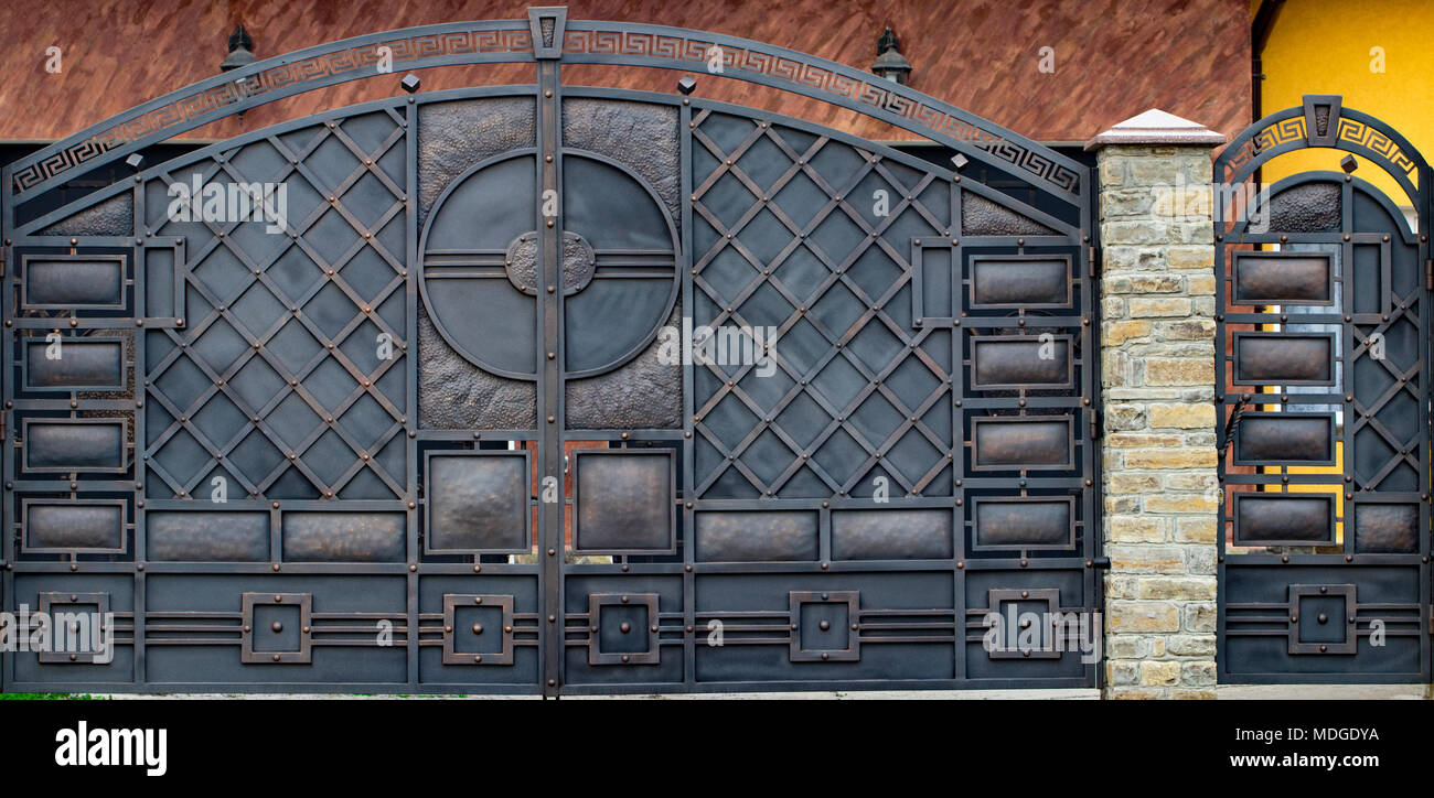 wrought-iron gates, ornamental forging, forged elements close-up Stock ...