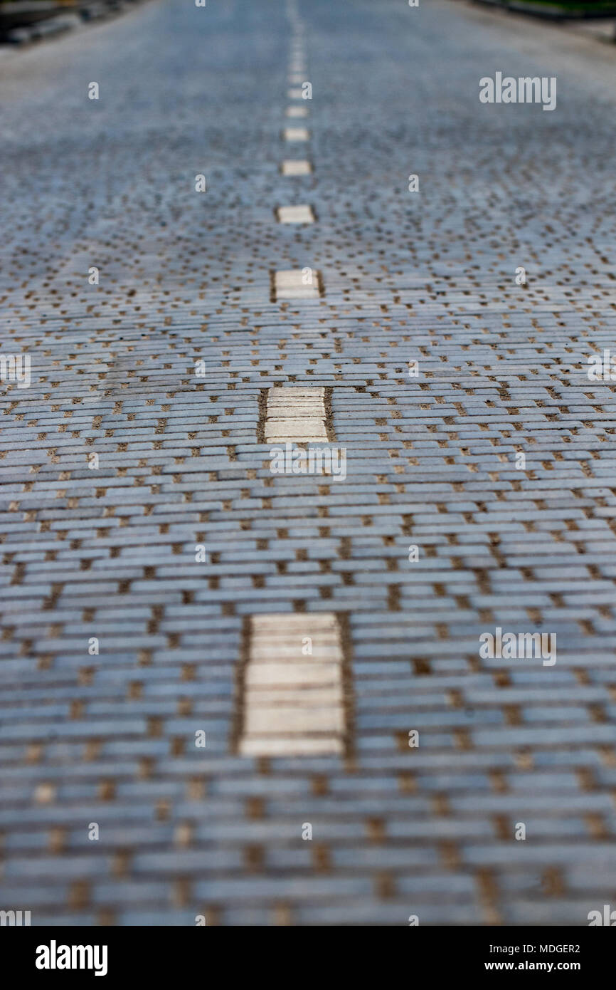 Interlocking paving with gray and white concrete blocks; Concrete products; Construction ...