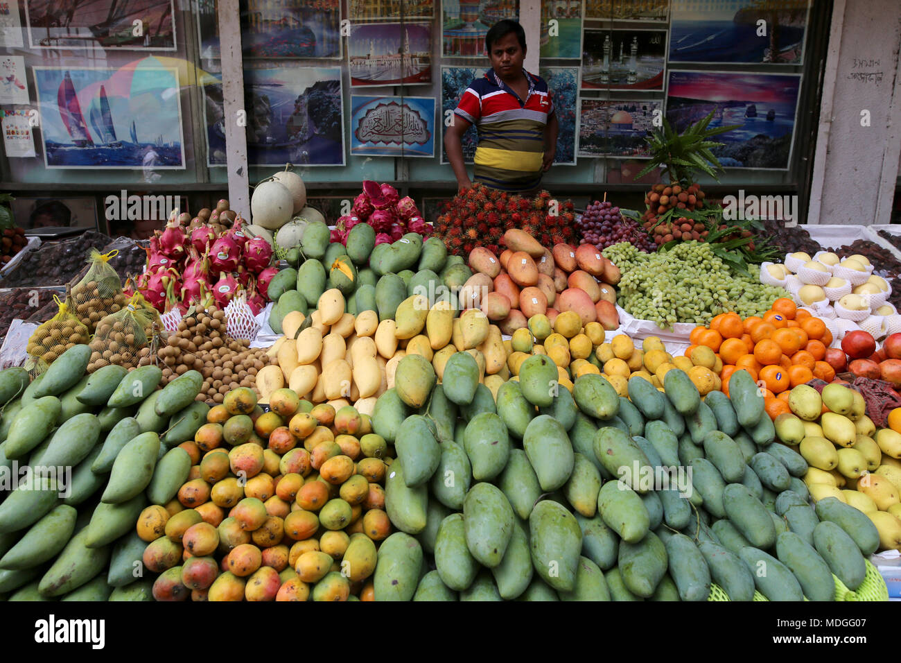 Dhaka, Bangladesh. Bangladeshi vendor sell fruits on a street market in Dhaka, Bangladesh on ...