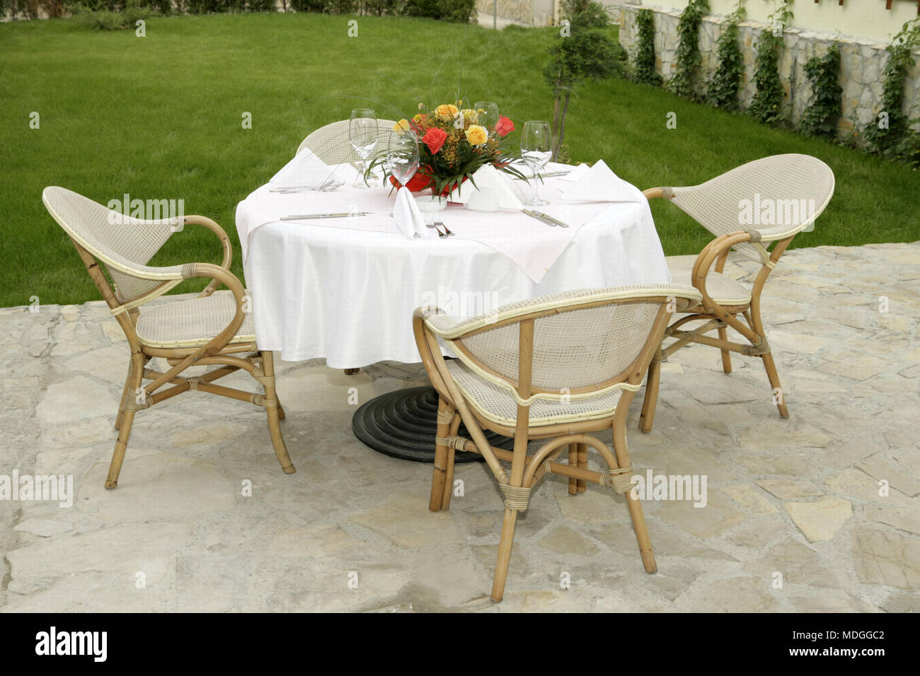 Table setting in garden Stock Photo - Alamy