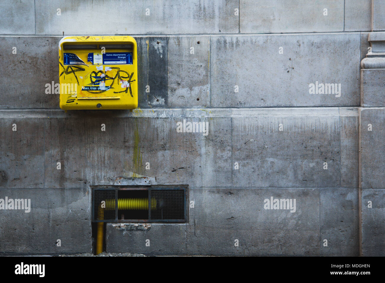 Yellow post box on the street of Paris, France Stock Photo - Alamy