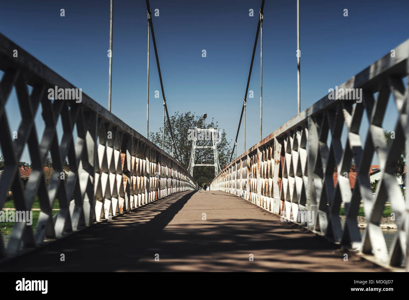 Suspension bridge over the river Stock Photo - Alamy