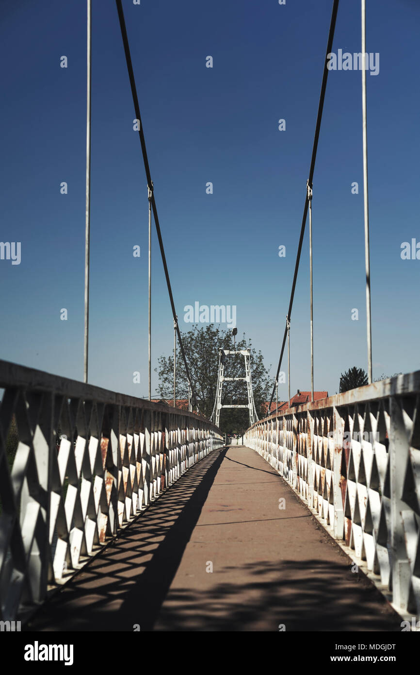 Suspension bridge over the river Stock Photo - Alamy