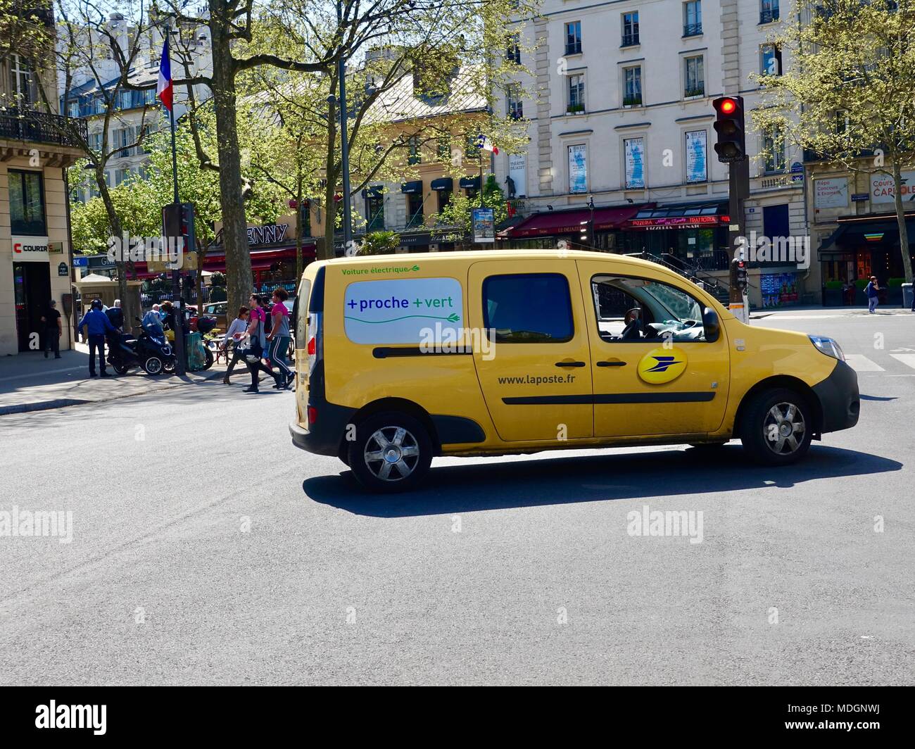 French postal service, electric delivery vehicle at Paris intersection ...