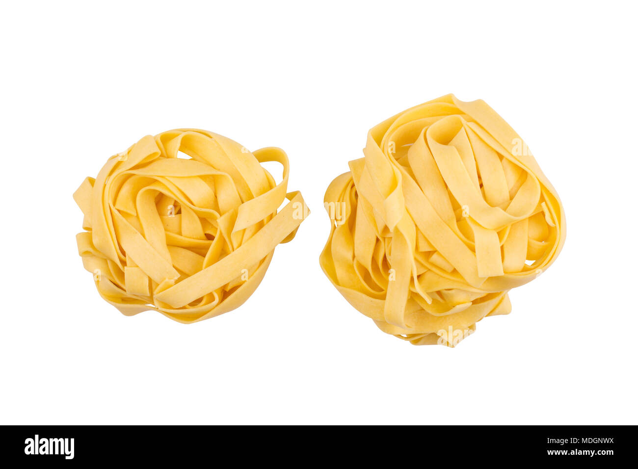 top view closeup detail of two balls of tagliatelle Italian pasta ...