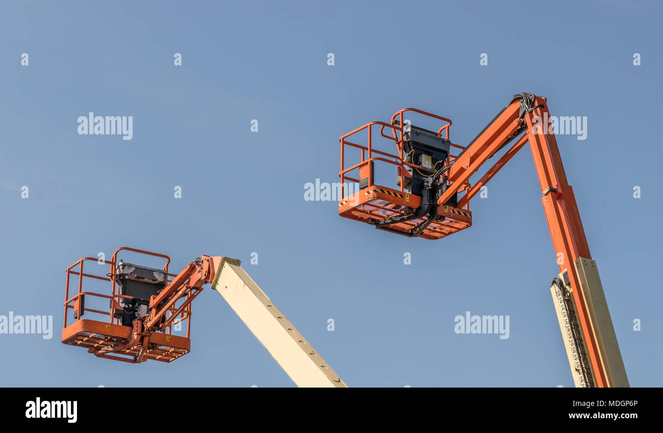 Blue cherry picker hi-res stock photography and images - Alamy