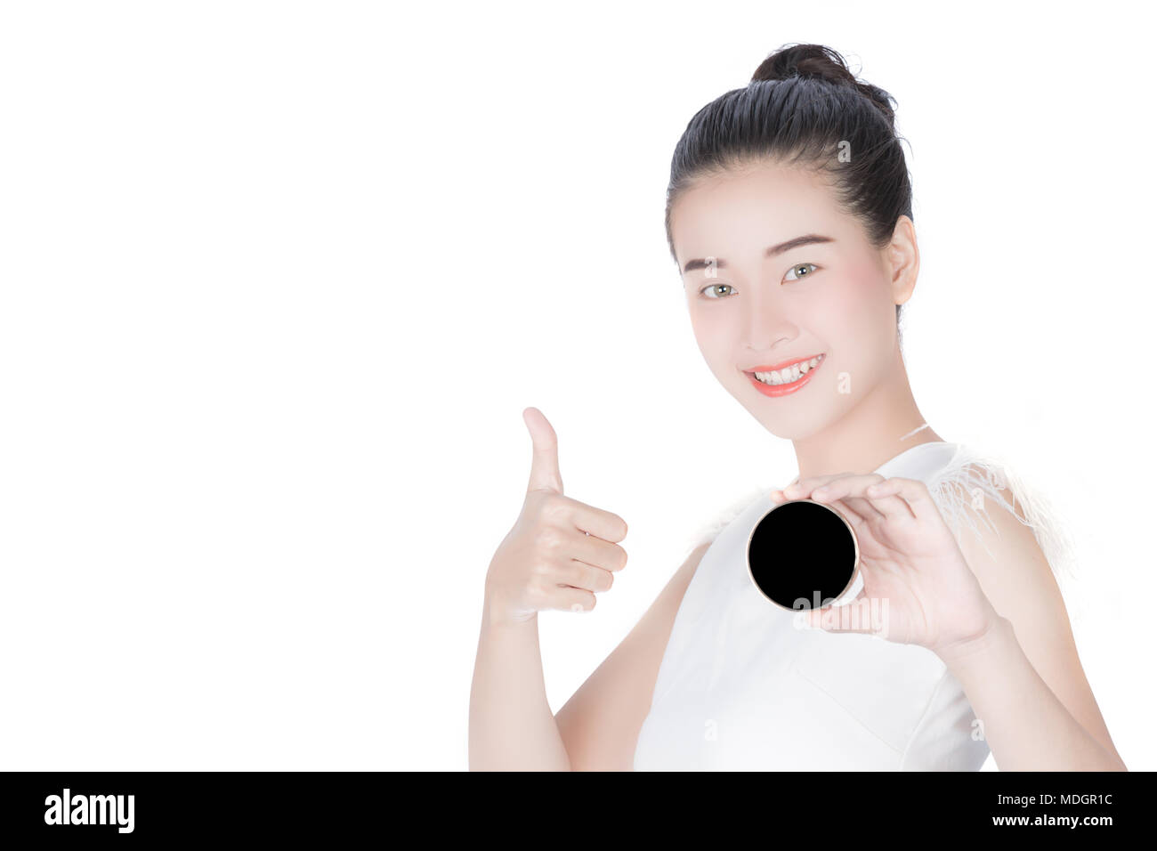 Woman holds the product for presentation. Lady beautiful in white shirt ...