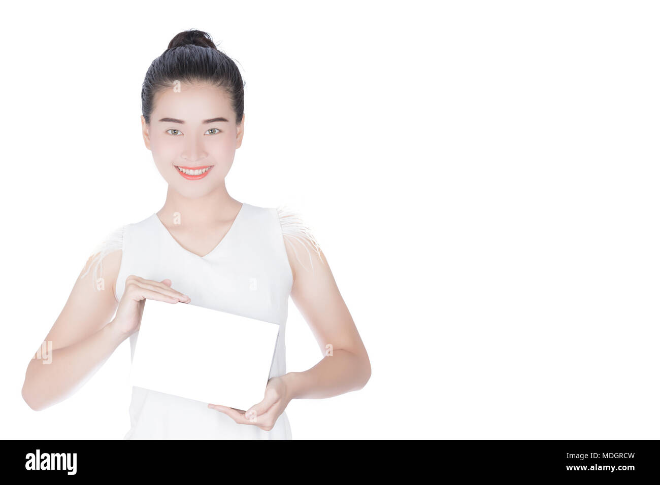 Woman holds the product for presentation. Lady beautiful in white shirt ...