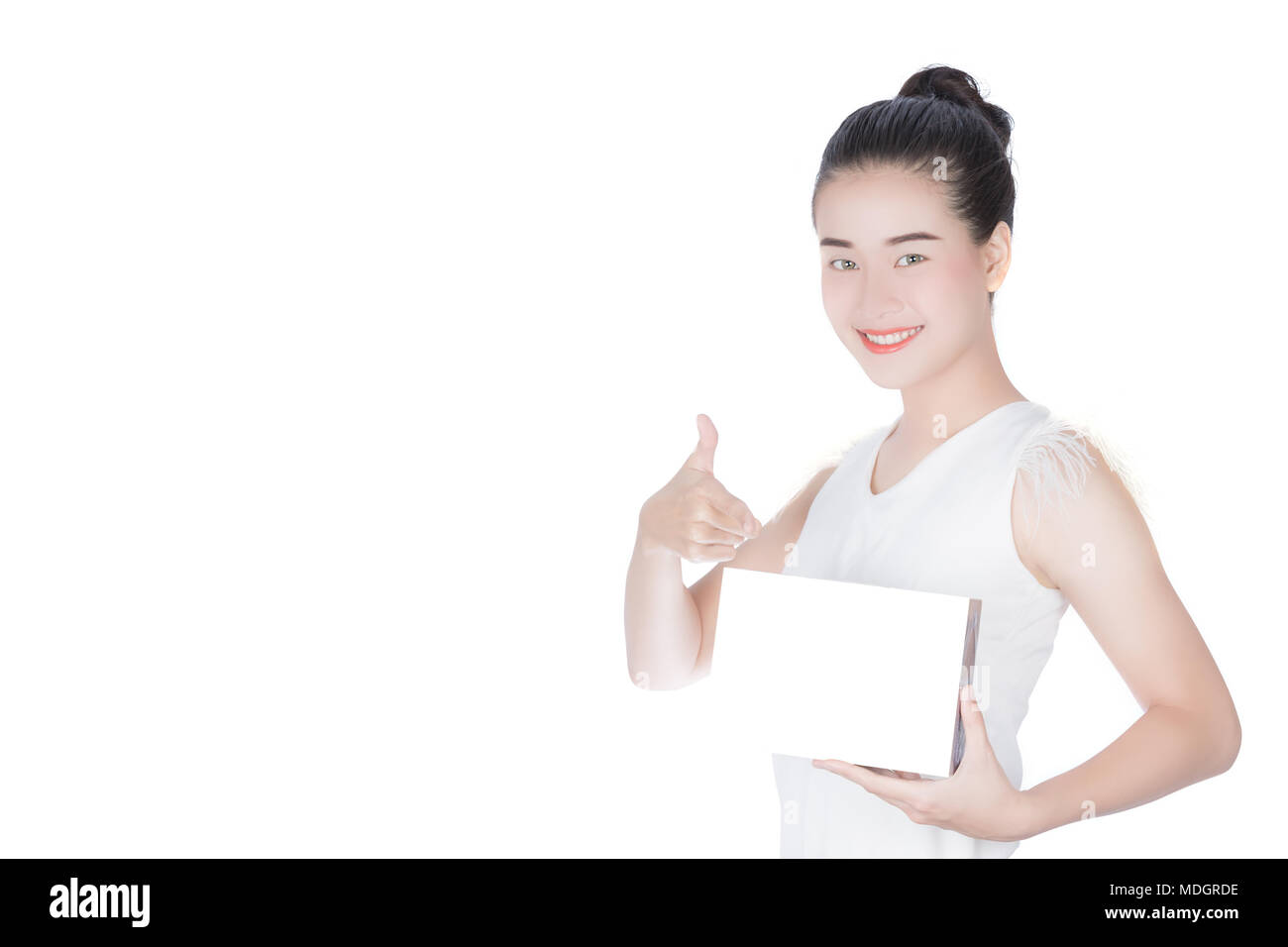 Woman holds the product for presentation. Lady beautiful in white shirt ...
