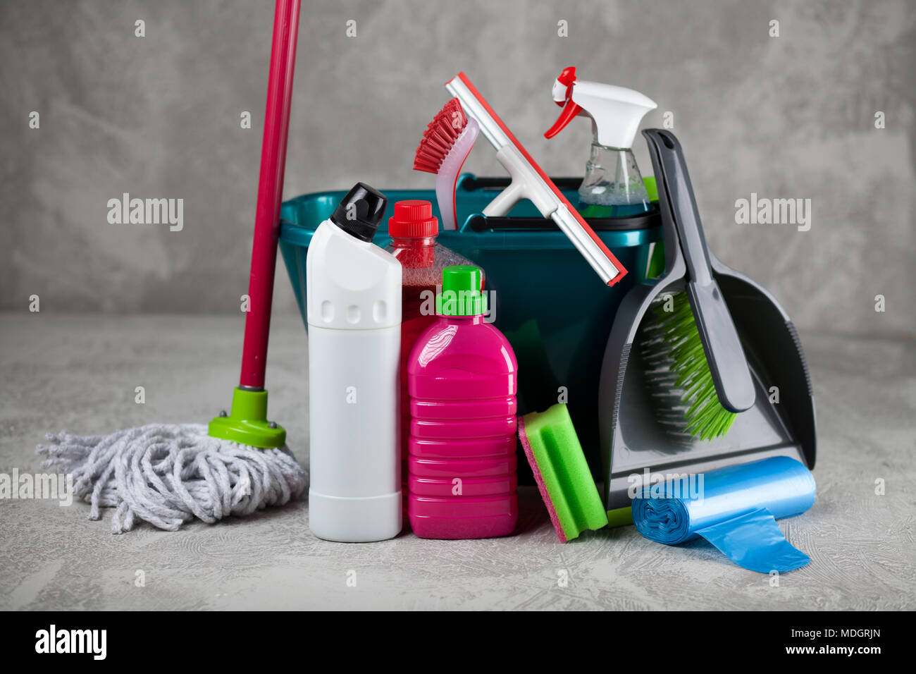 Set of cleaning supplies on grey background Stock Photo - Alamy