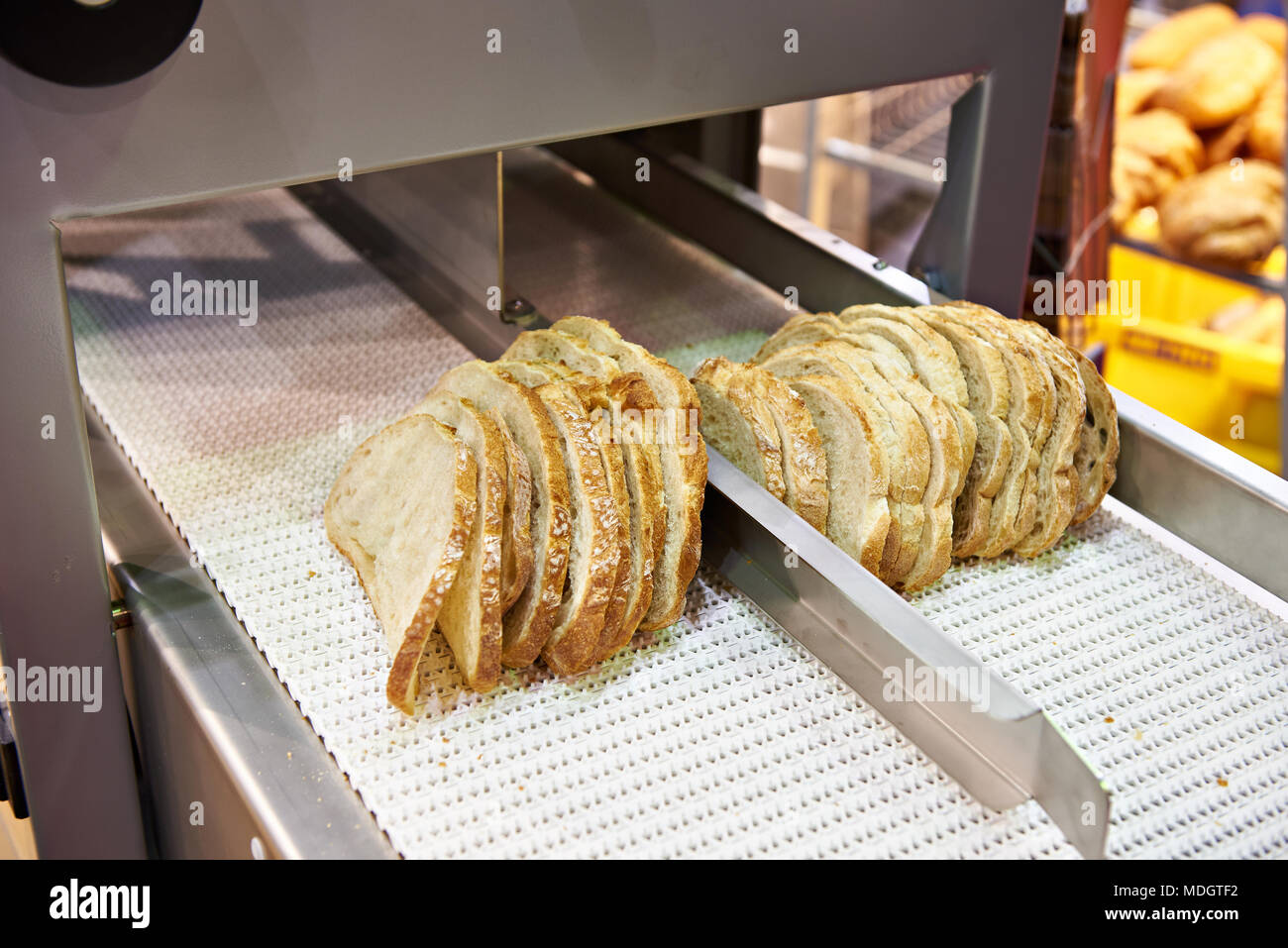 Sliced bread in a cutting machine Stock Photo - Alamy