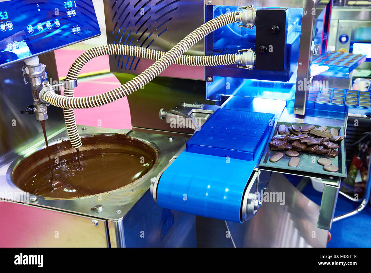 Modern machine for making chocolate Stock Photo - Alamy