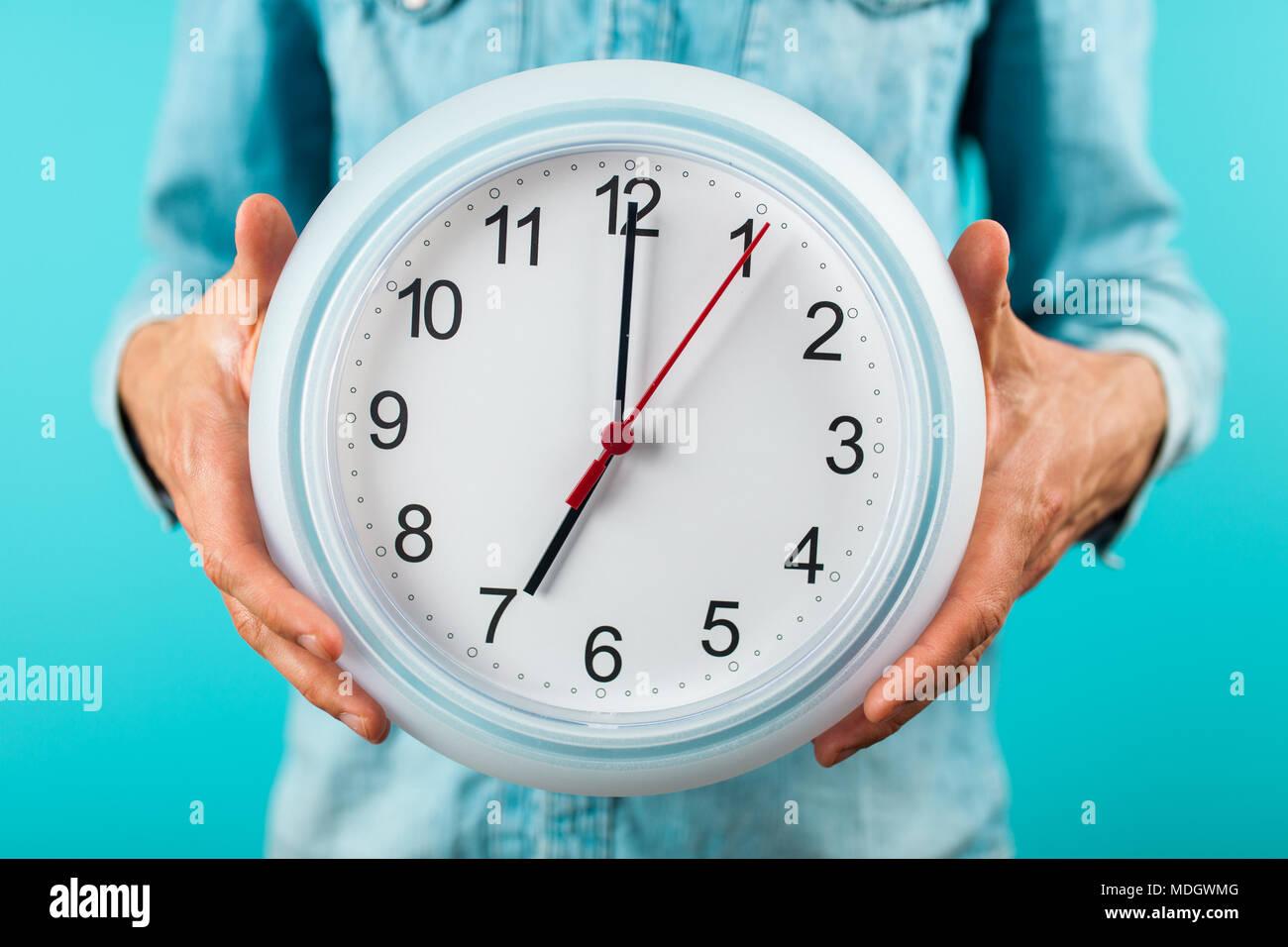 Happy man holding clock isolated hi-res stock photography and images ...