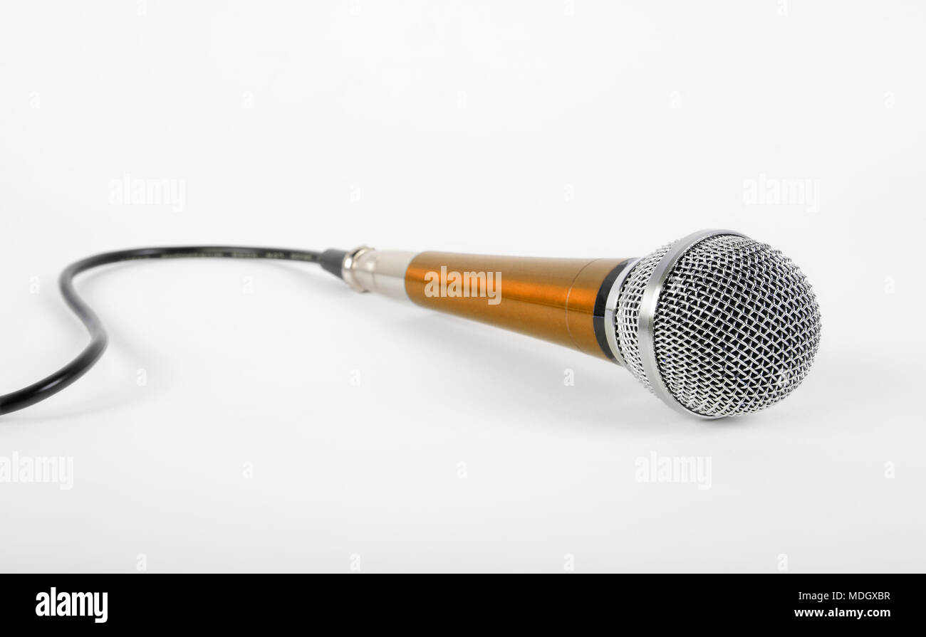 Music and sound - Vintage orange vocal microphone on a white background ...