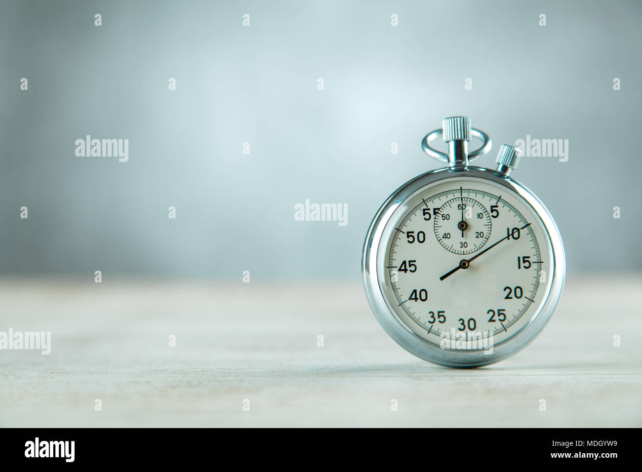 Analog stopwatch closeup on grey background Stock Photo - Alamy