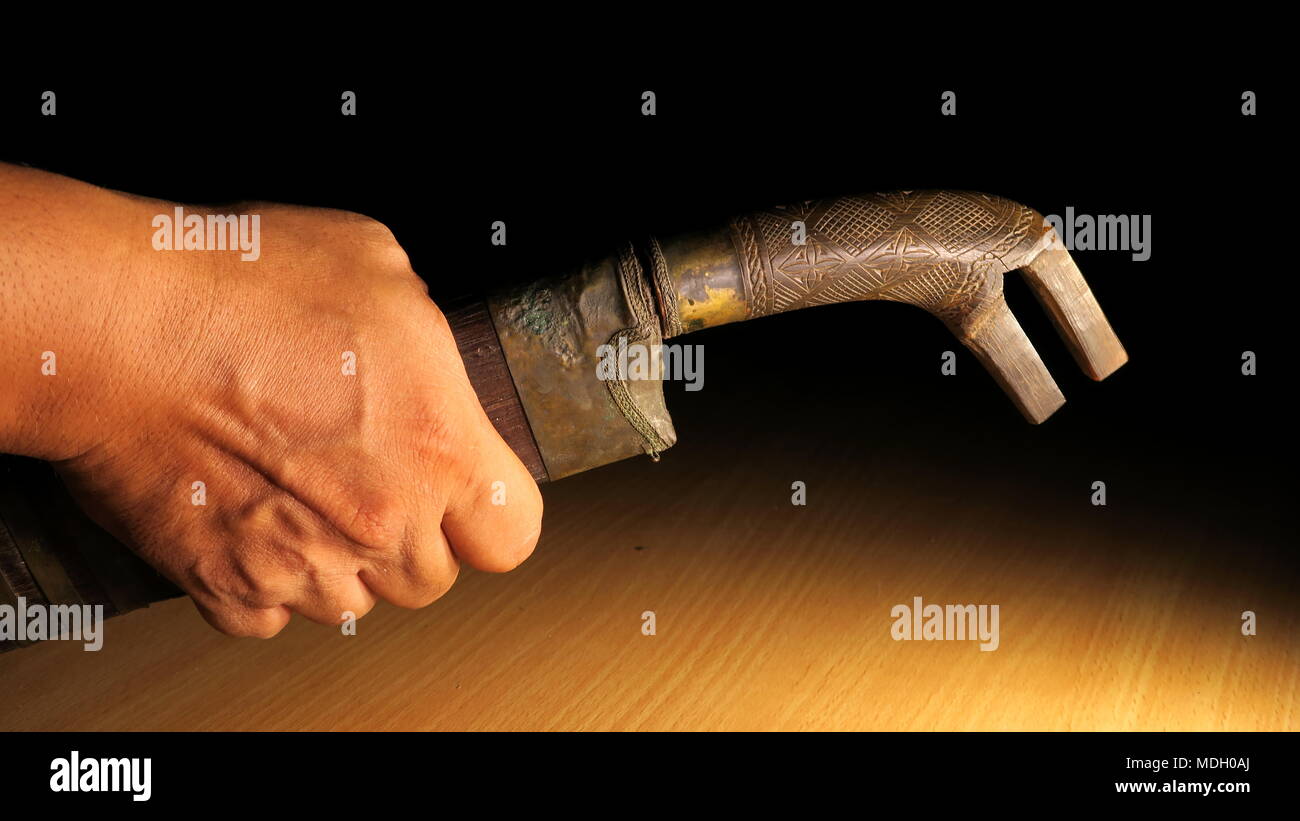 Hand Holding Acehnese traditional ancient machete Stock Photo - Alamy