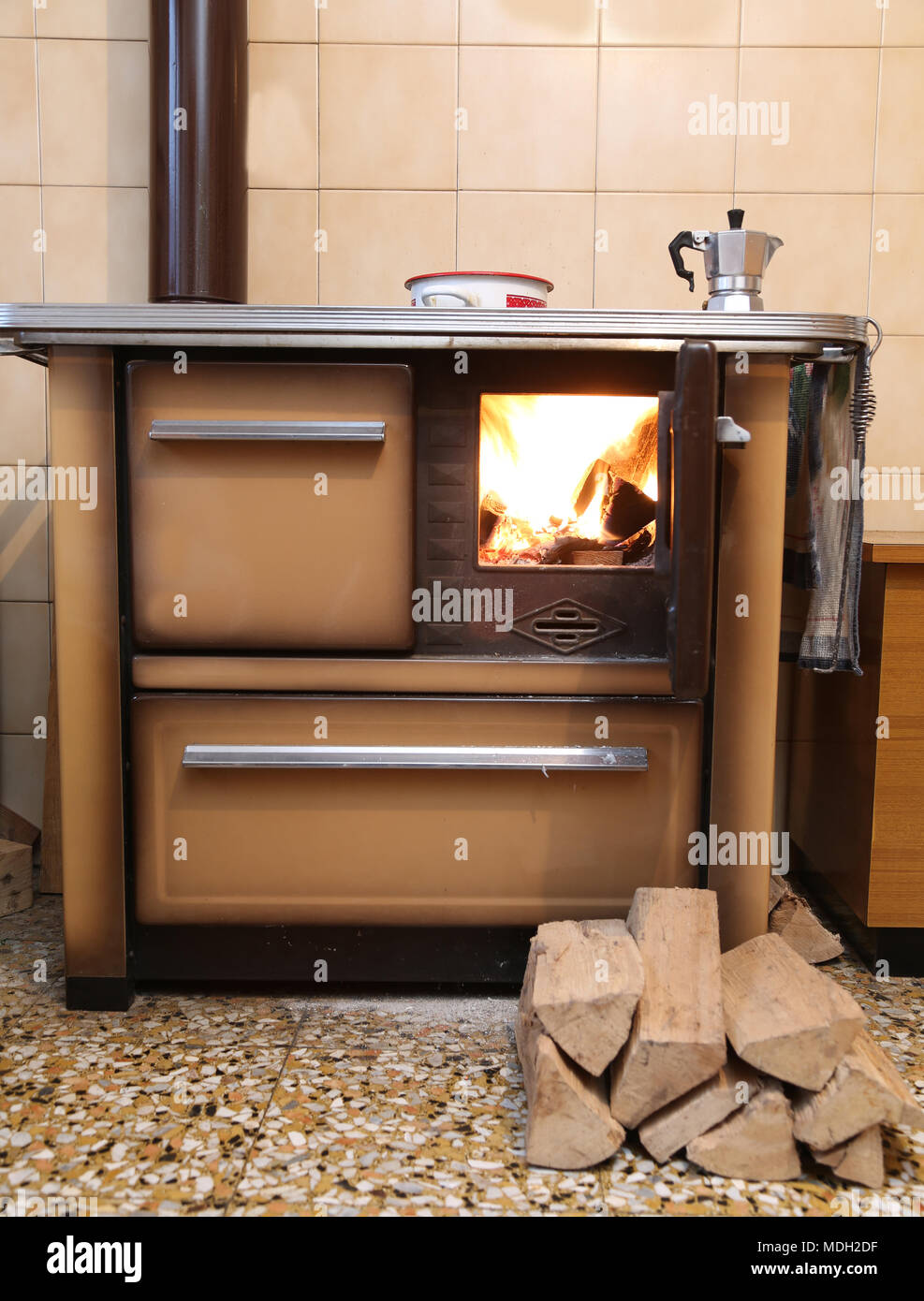 wood-burning stove in the kitchen of an home in mountain with fire ...