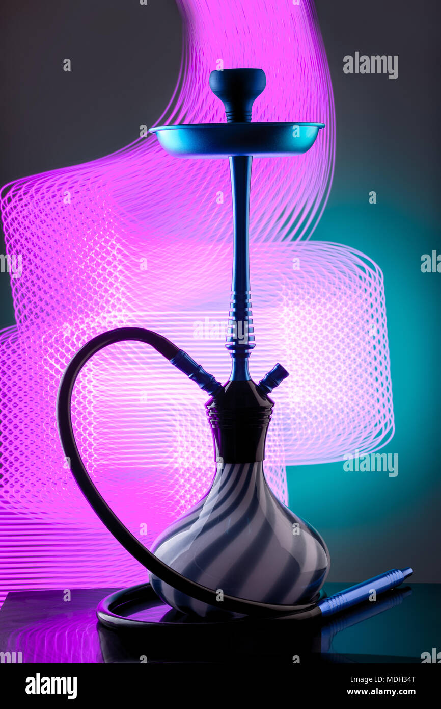 Blue eastern hookah on colorful background Stock Photo - Alamy