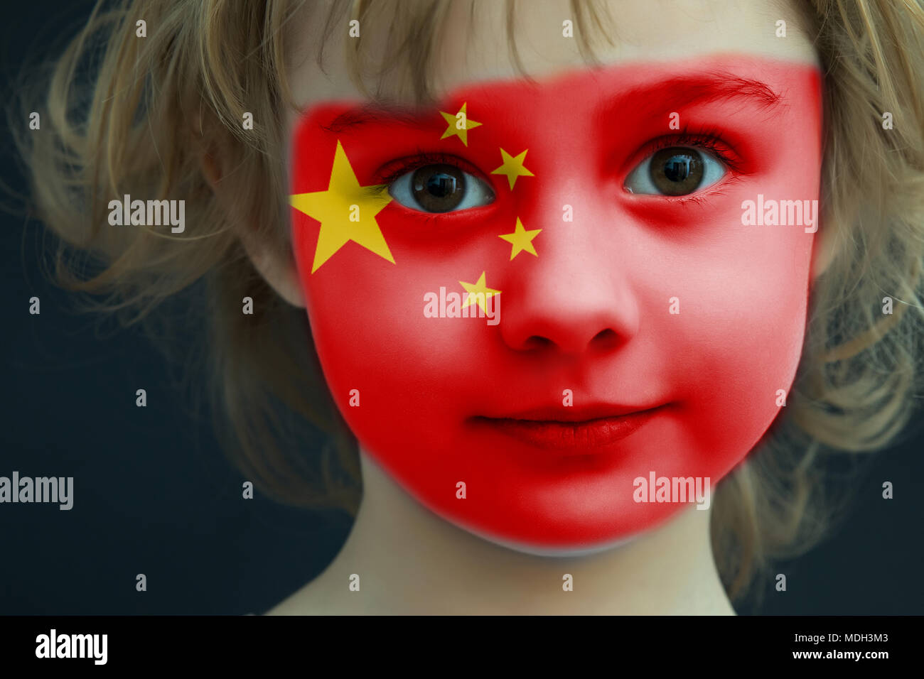 Child with a painted flag of China Stock Photo - Alamy