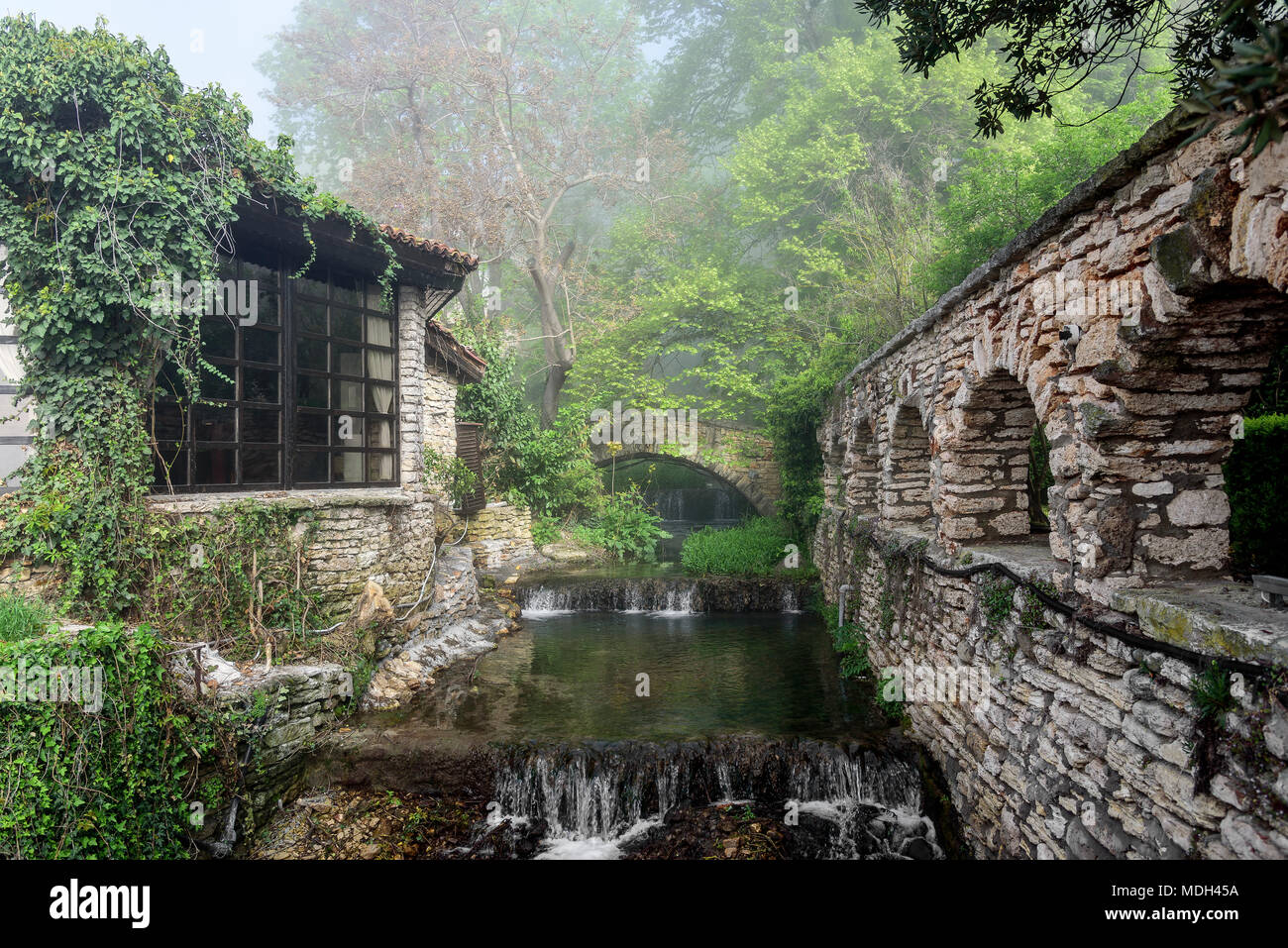 An old stone building and a gazebo in the forest Stock Photo - Alamy