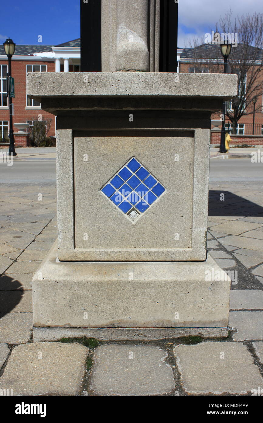 Public pillar with a square blue tile design Stock Photo - Alamy