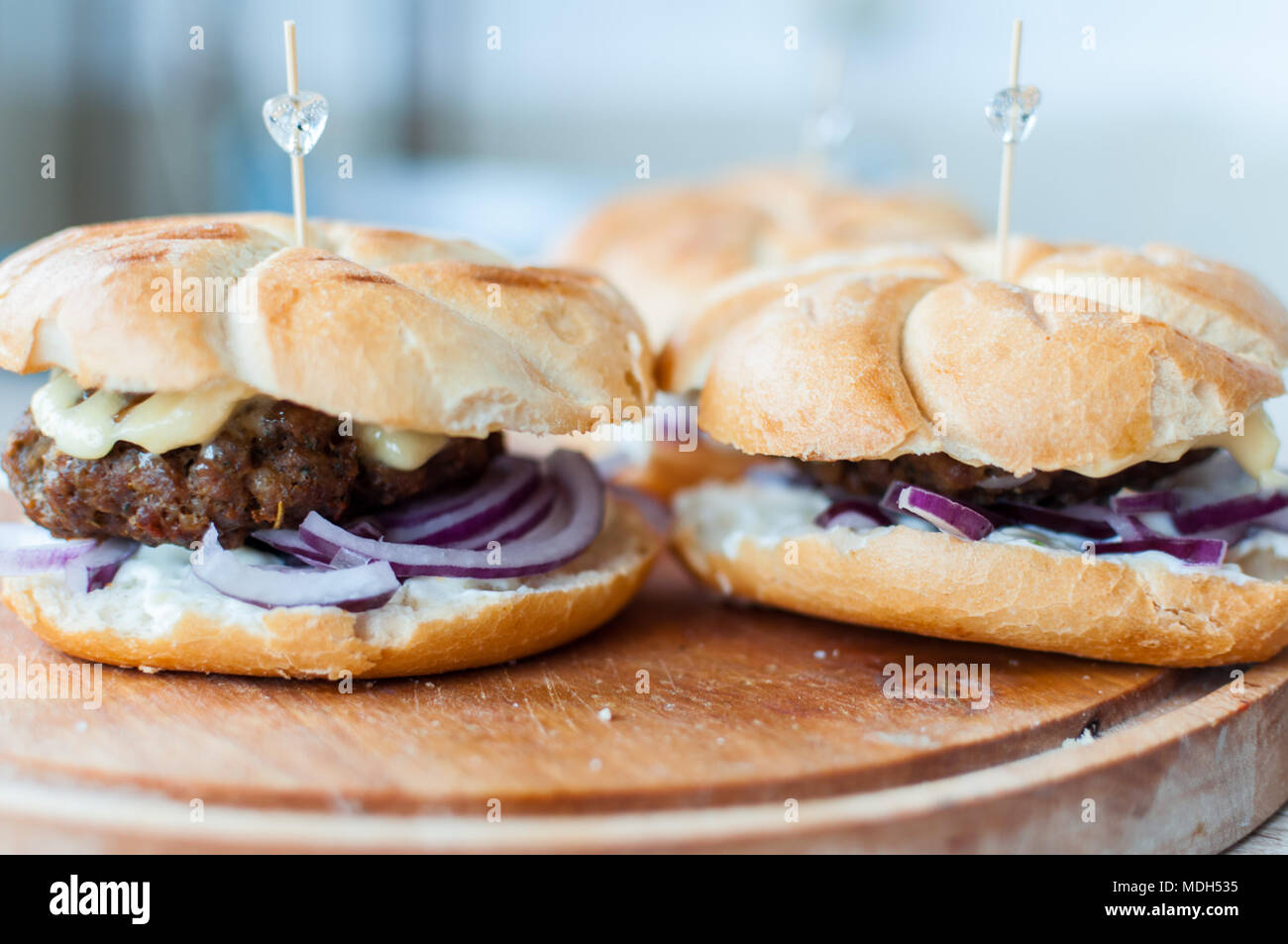 Home made burger on a wooden chopping board Stock Photo - Alamy