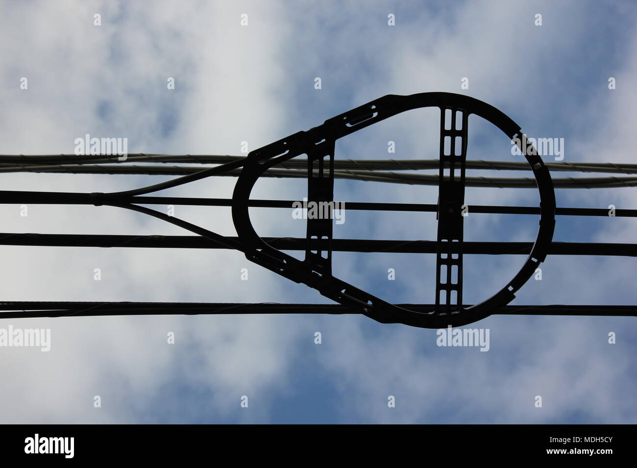 Loop in overhead residential electrical wires Stock Photo - Alamy