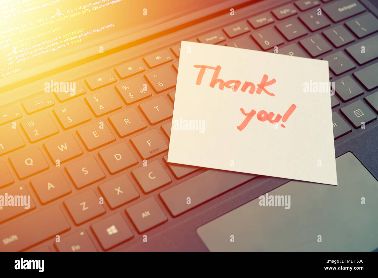 Thank you message concept written post it on laptop keyboard Stock ...