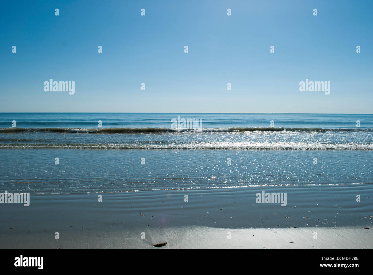 Ocean shore. Ocean view landmark. Beach home. Waves and sandy shore ...